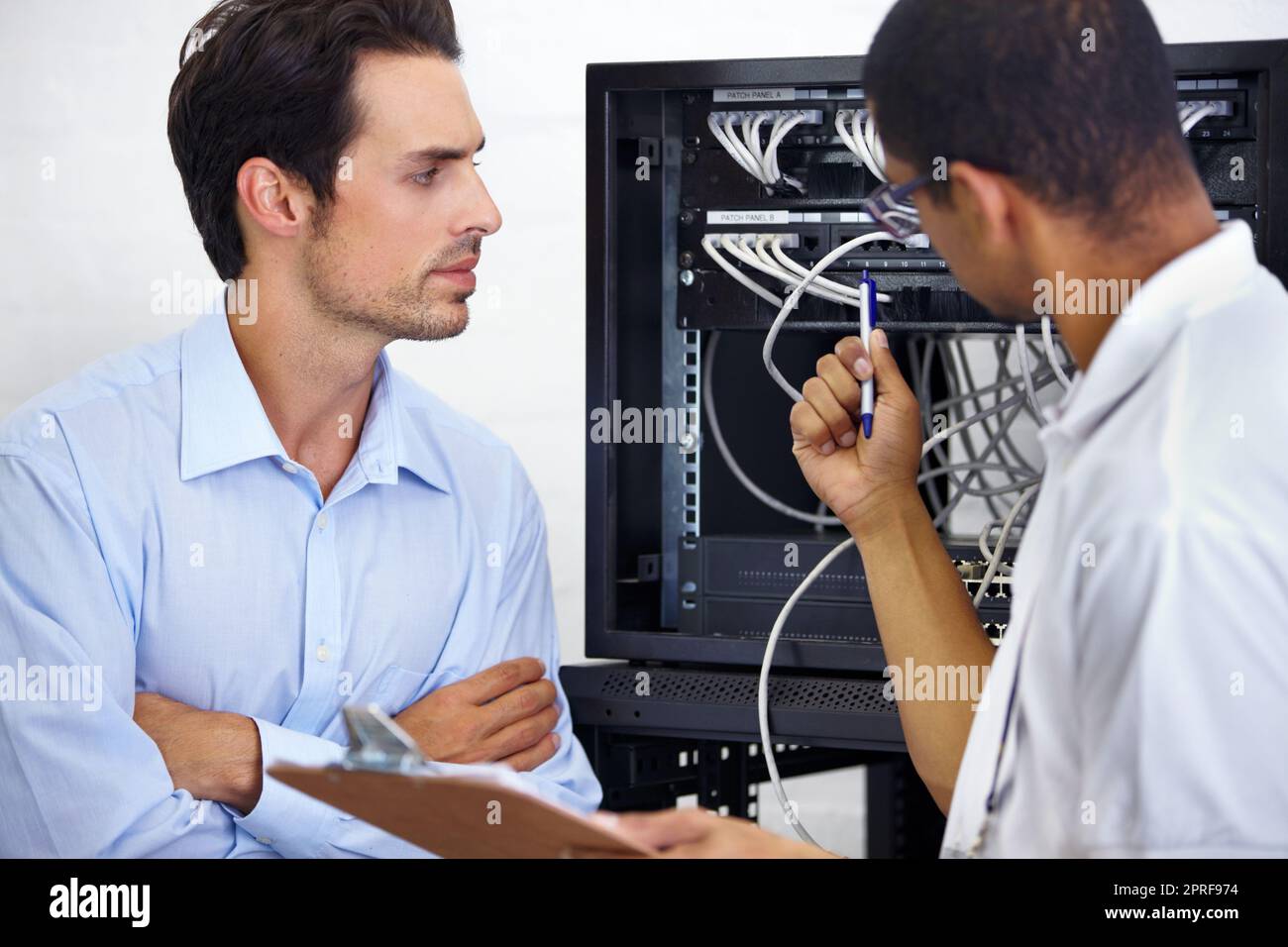 Making sure the systems run smoothly. A young IT specialist ready to ...