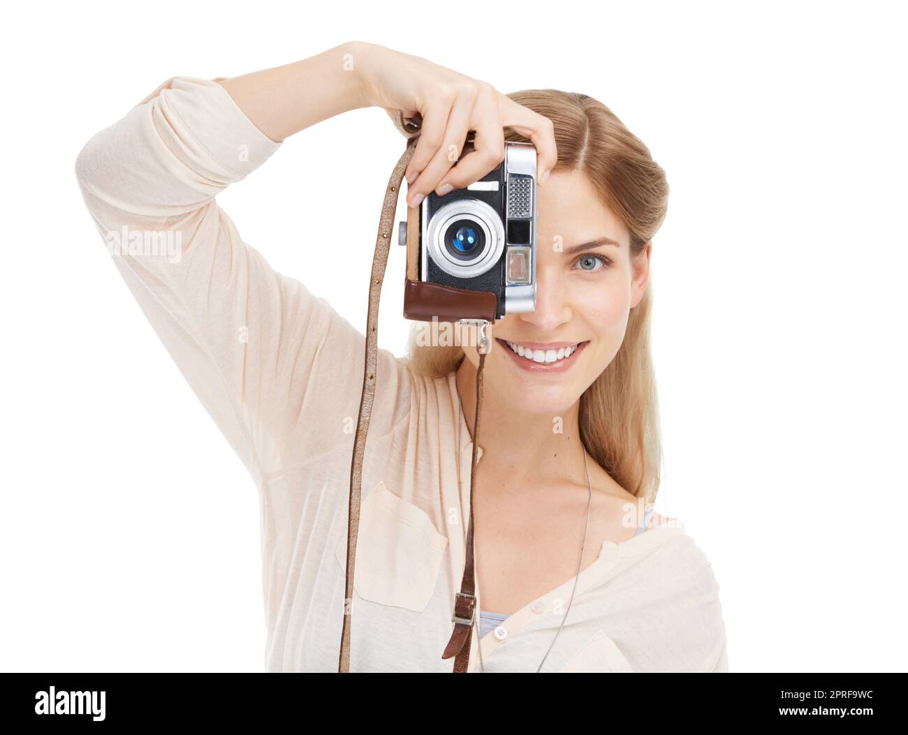 Confident behind the camera. Studio shot of a beautiful young woman ...