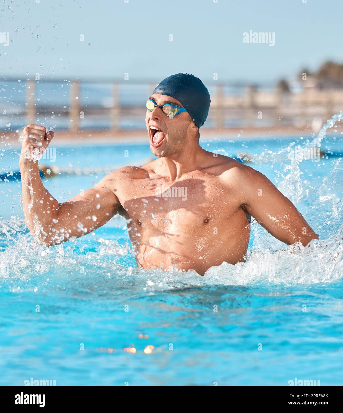 Yes. a handsome young male athlete swimming in an olympic-sized pool ...