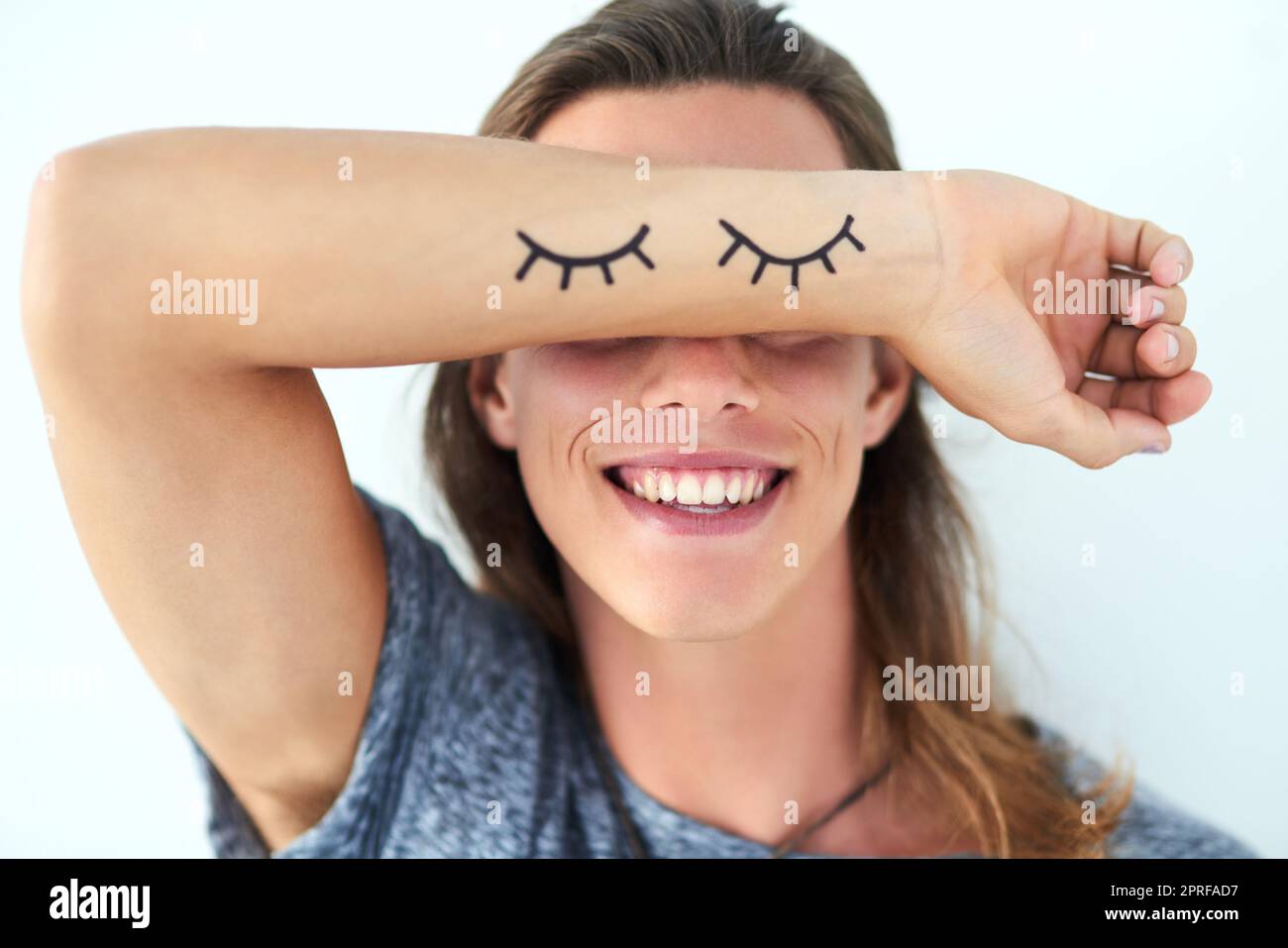 I choose to see what makes me happy. Studio shot of a young man raising ...