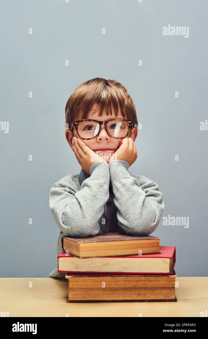 Child leaning over desk hi-res stock photography and images - Alamy