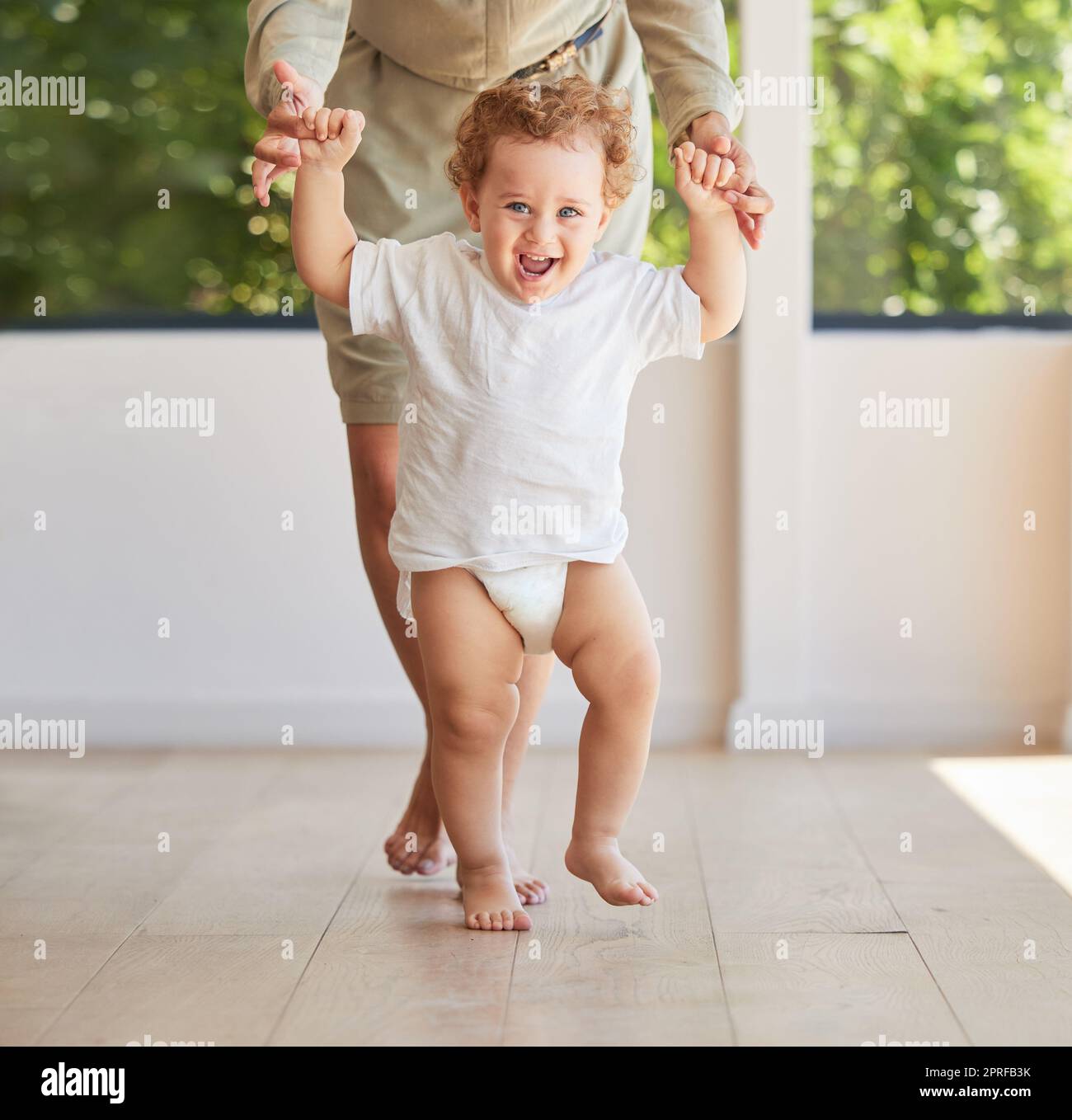 Young mother teaching baby walking hi-res stock photography and images ...