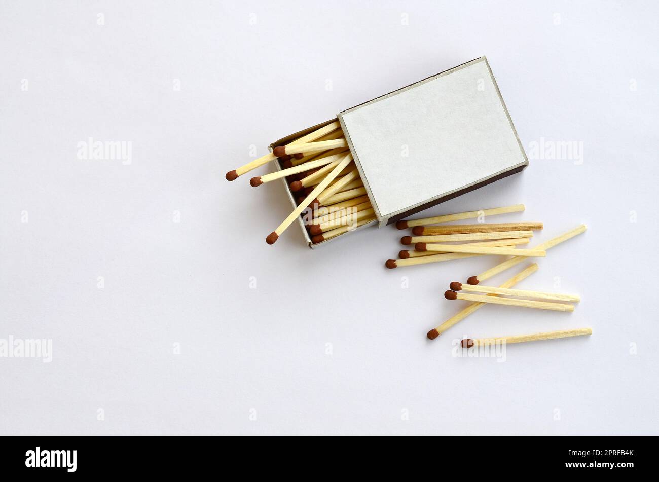 Open cardboard matchbox filled with matches on a white background. Flat ...