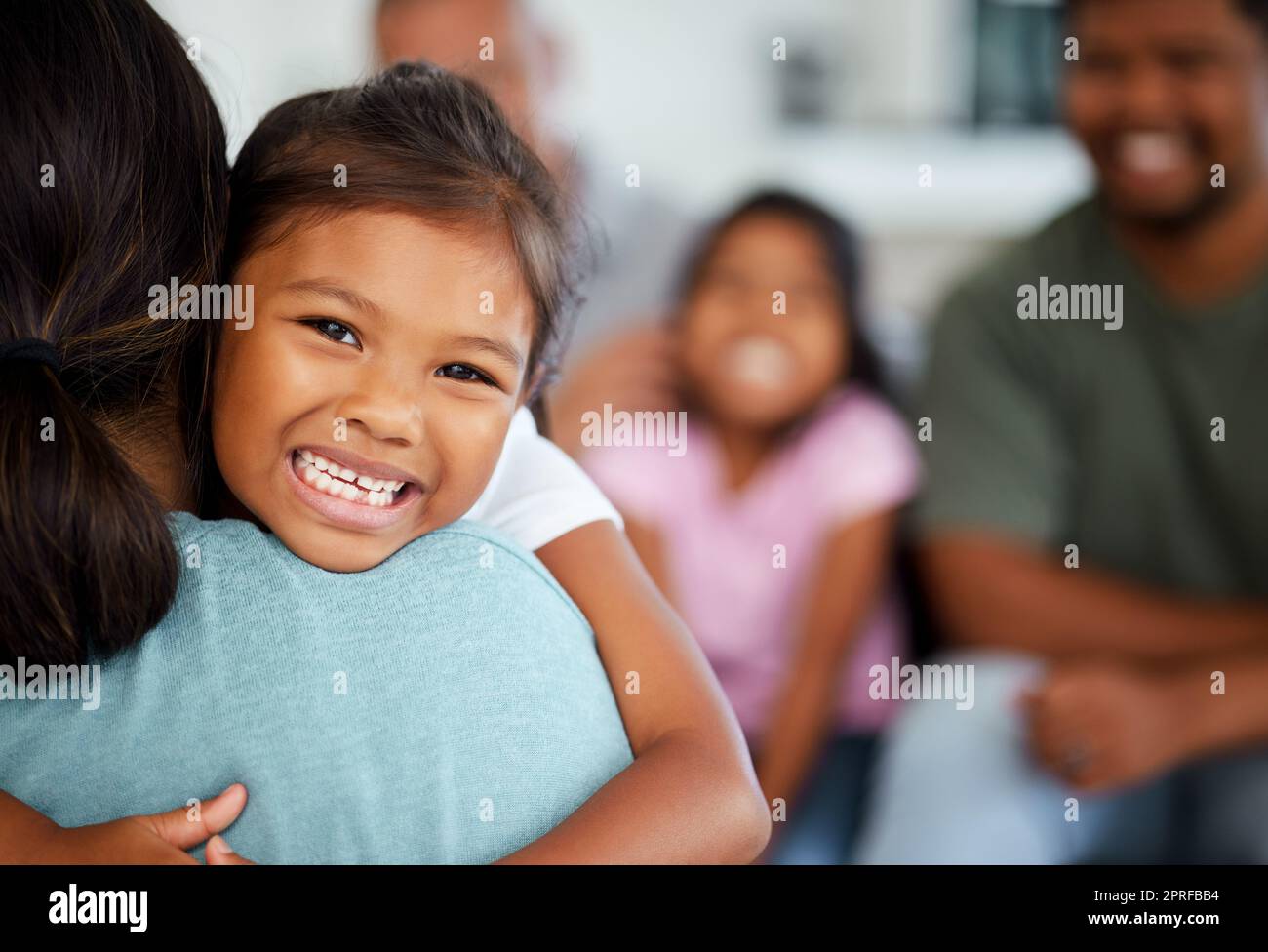 Family, Indian and girl hug mom with happy smile and laugh, excited at ...