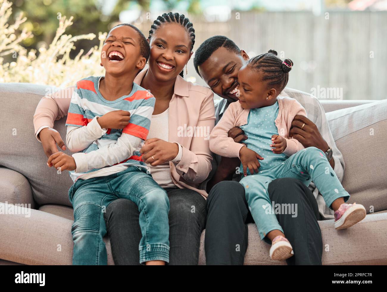 Welcome to our crazy family. a family relaxing together at home Stock ...