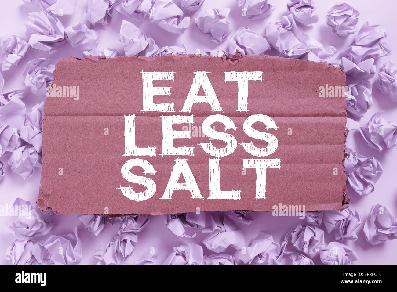 Sign displaying Eat Less Salt. Business showcase Reduce the amount of ...
