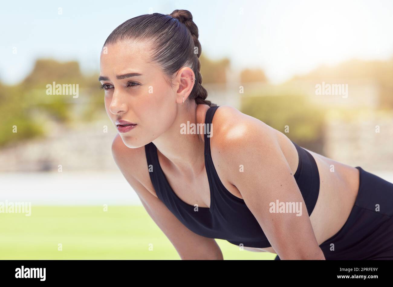 Focused female track and field athlete hi-res stock photography and ...