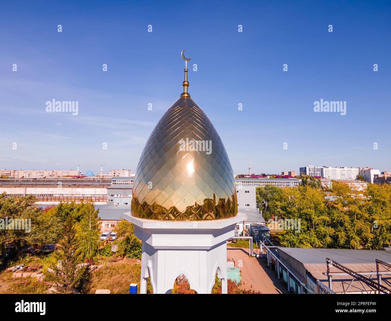 A Muslim golden dome with a crescent moon on the mosque. Minaret ...