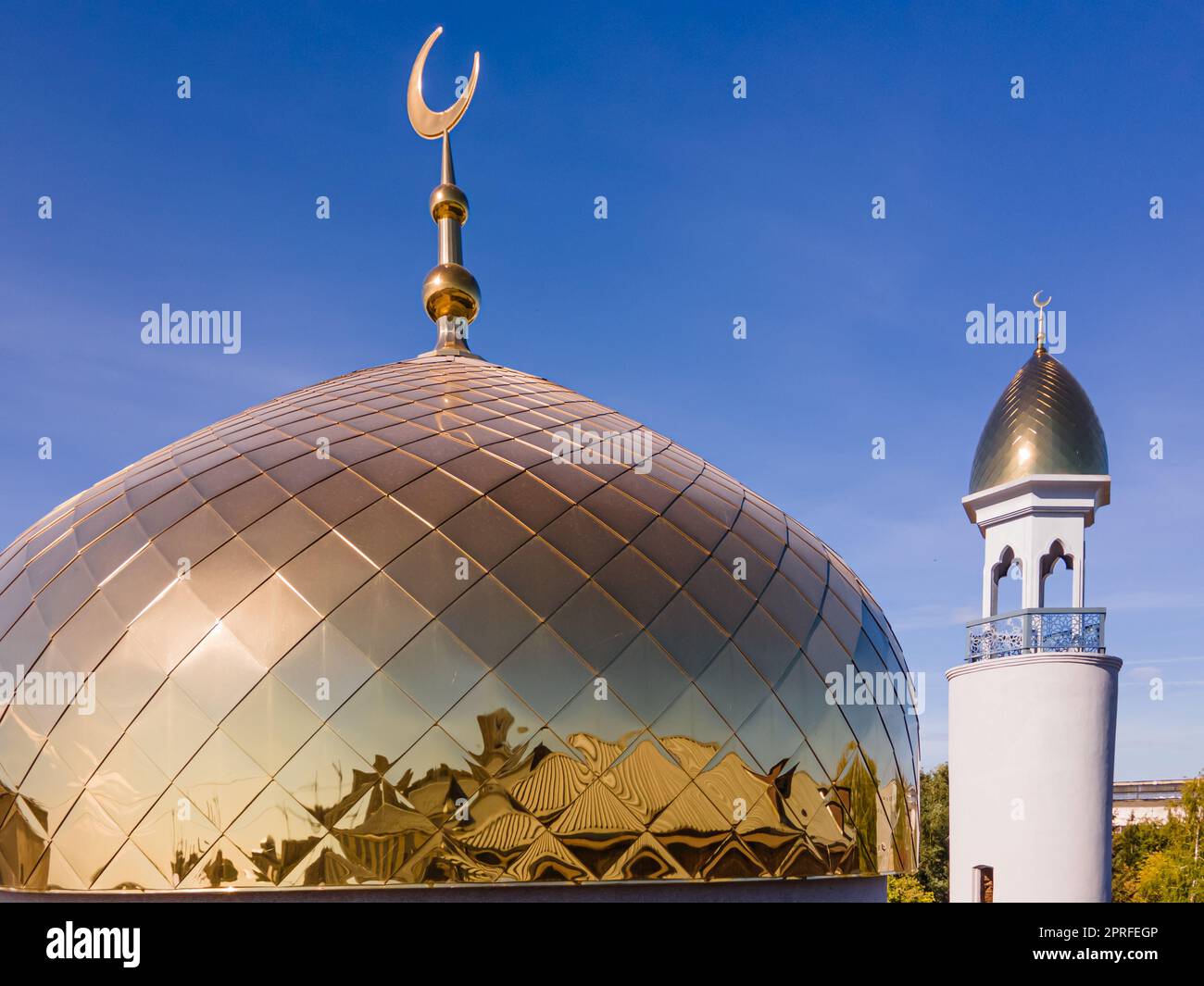 A Muslim golden dome with a crescent moon on the mosque. Minaret ...