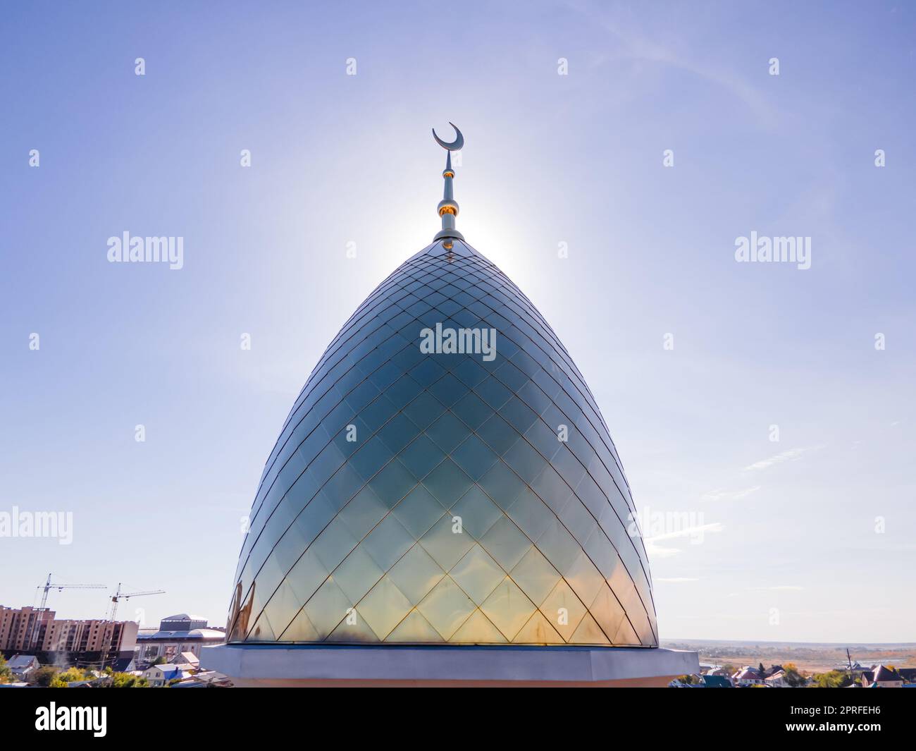 A Muslim golden dome with a crescent moon on the mosque. Minaret ...