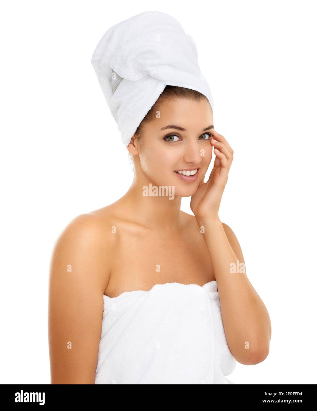 I strive for silky skin always. Cropped portrait of a gorgeous young woman touching her face ...