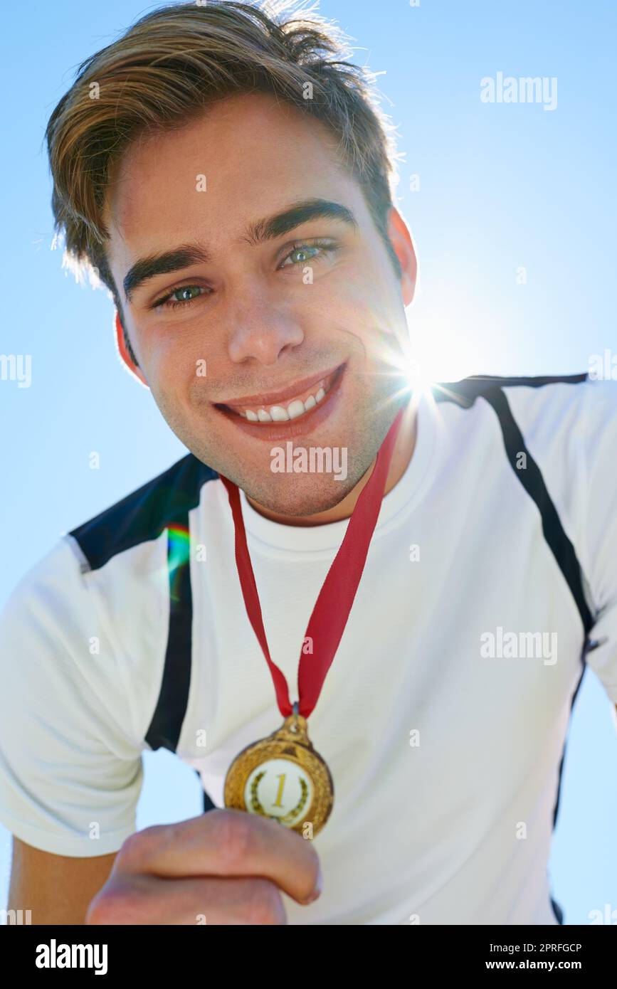 Holding medal award smiling hi-res stock photography and images - Alamy