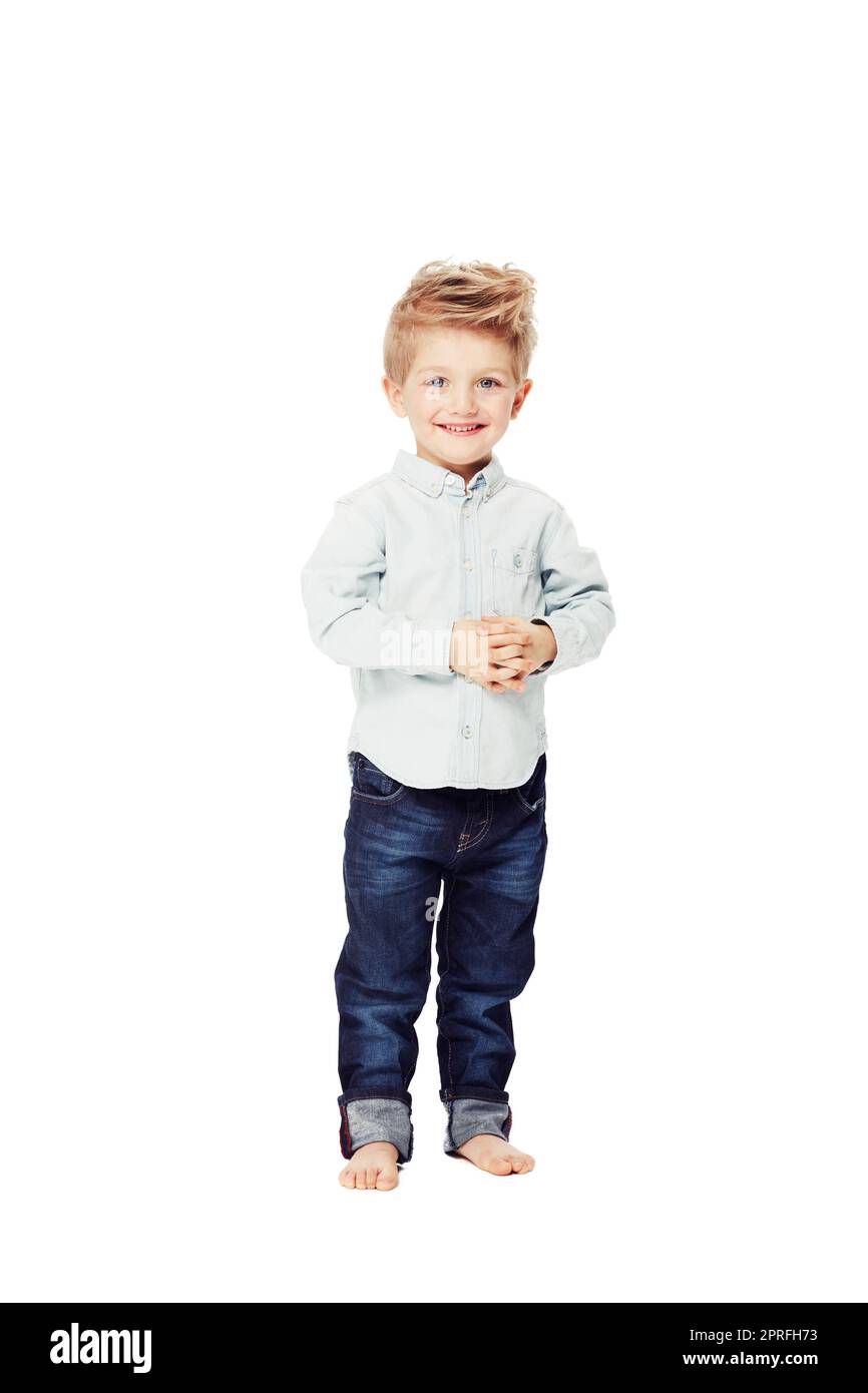 Beaming with boyhood confidence. A cute little boy looking at the ...