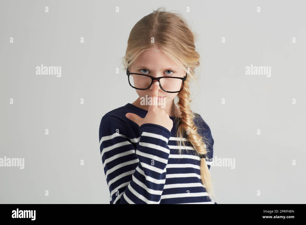Im Watching Youportrait Of A Cute Girl Pushing Her Hipster Glasses Back Onto Her Nose Stock