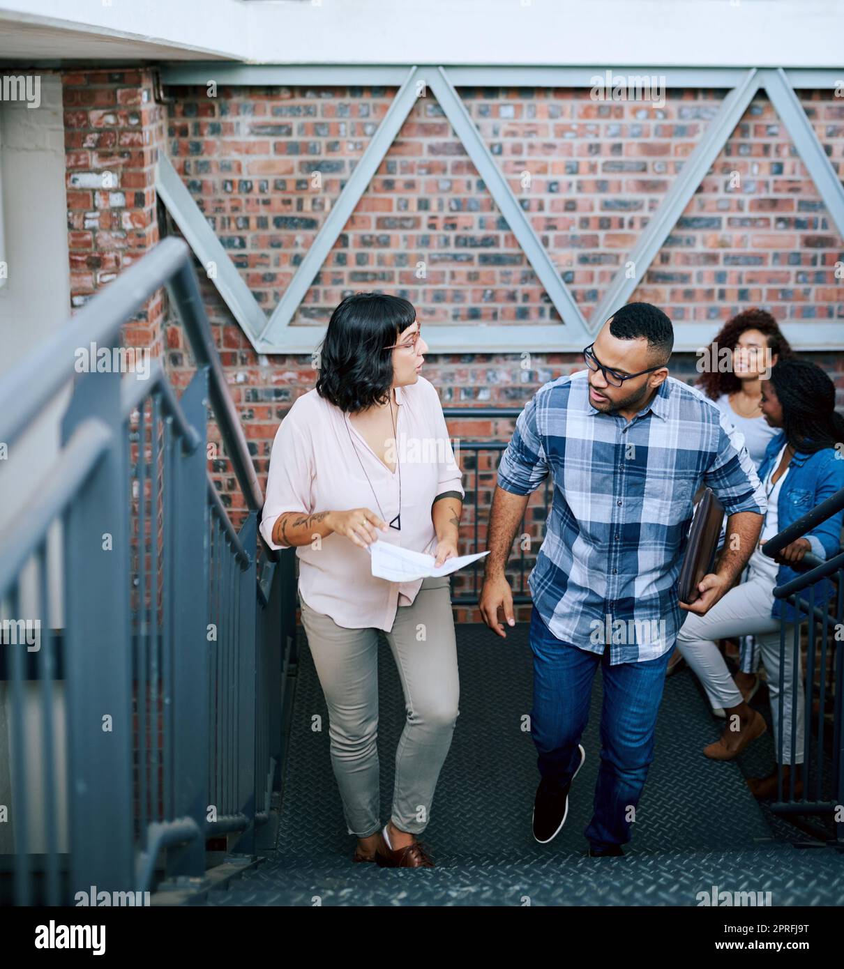 Moving in the direction of success. two colleagues having a discussion ...