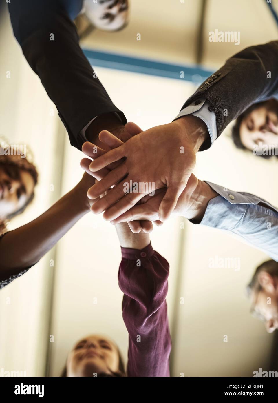 Unity makes them unstoppable. Low angle shot of a team of ...