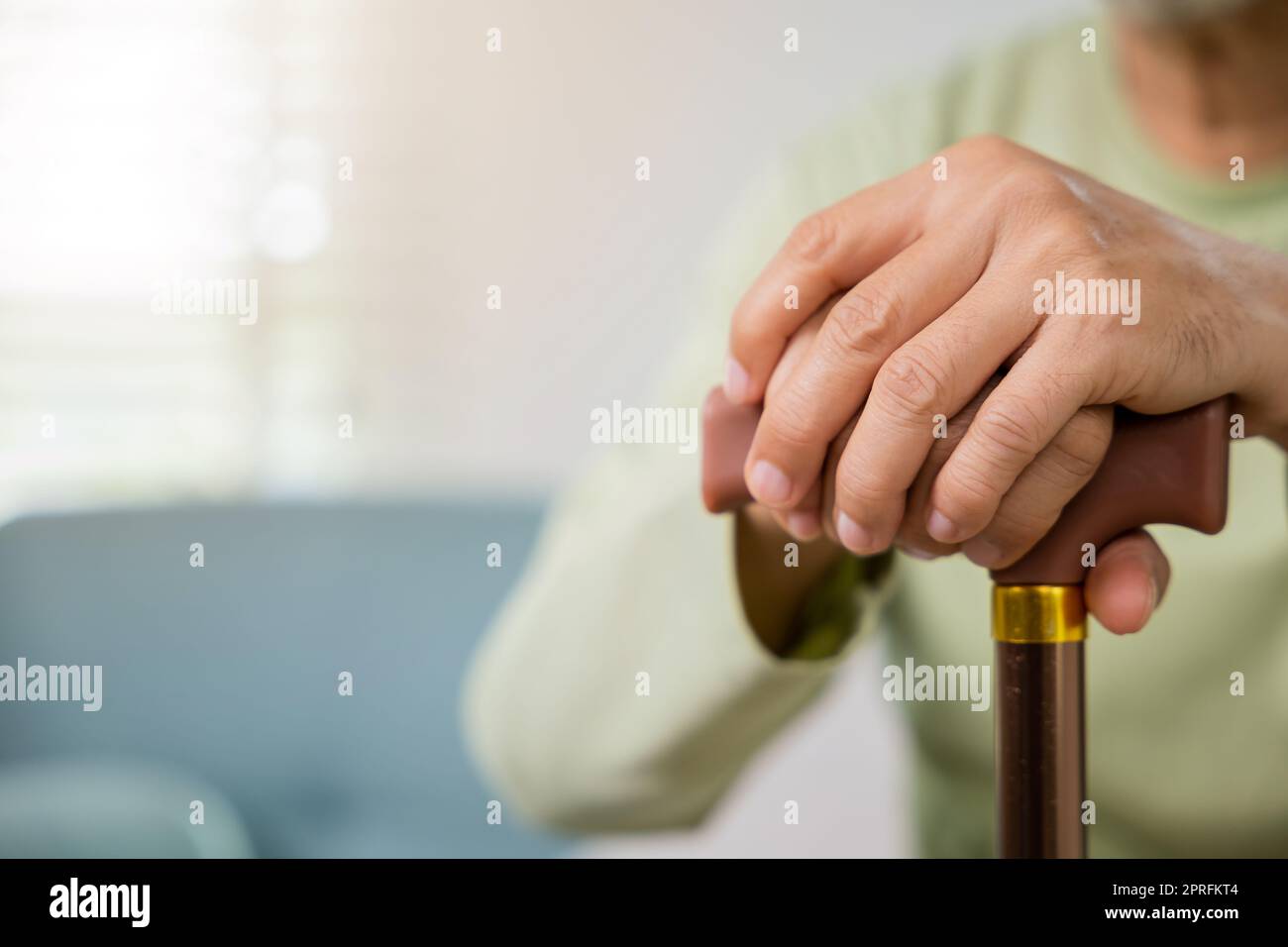 Closeup hands of senior disabled man holding walking stick, Old man ...