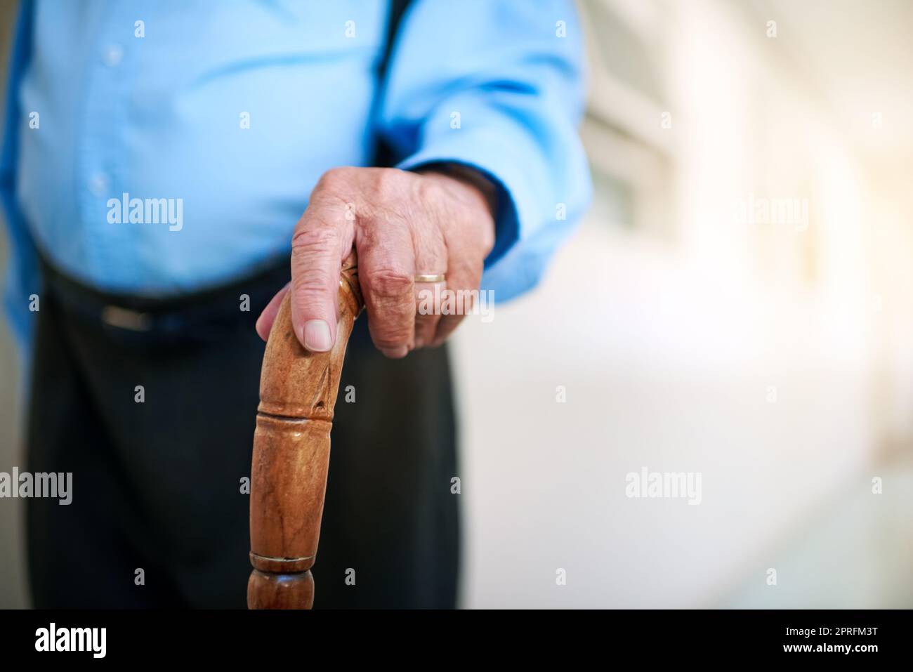 Unidentifiable man walking with cane hi-res stock photography and ...