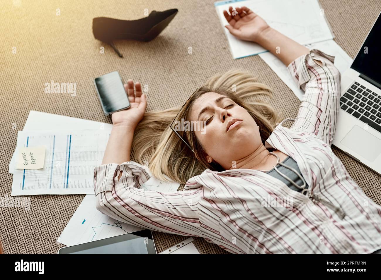 Business woman lying on floor hi-res stock photography and images - Alamy