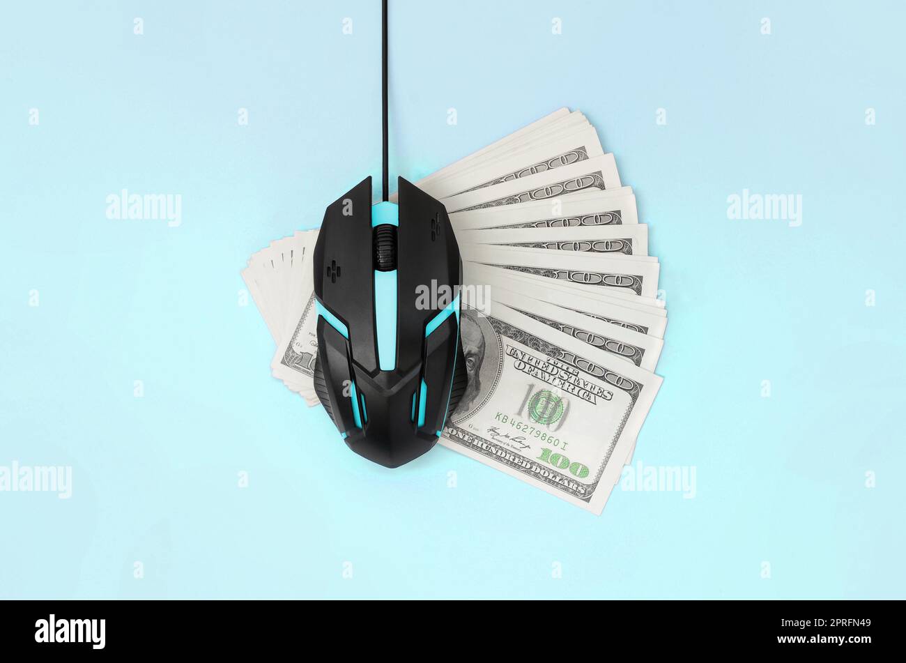 Computer mouse on many dollar bills. Pay per click and autoclicker ...