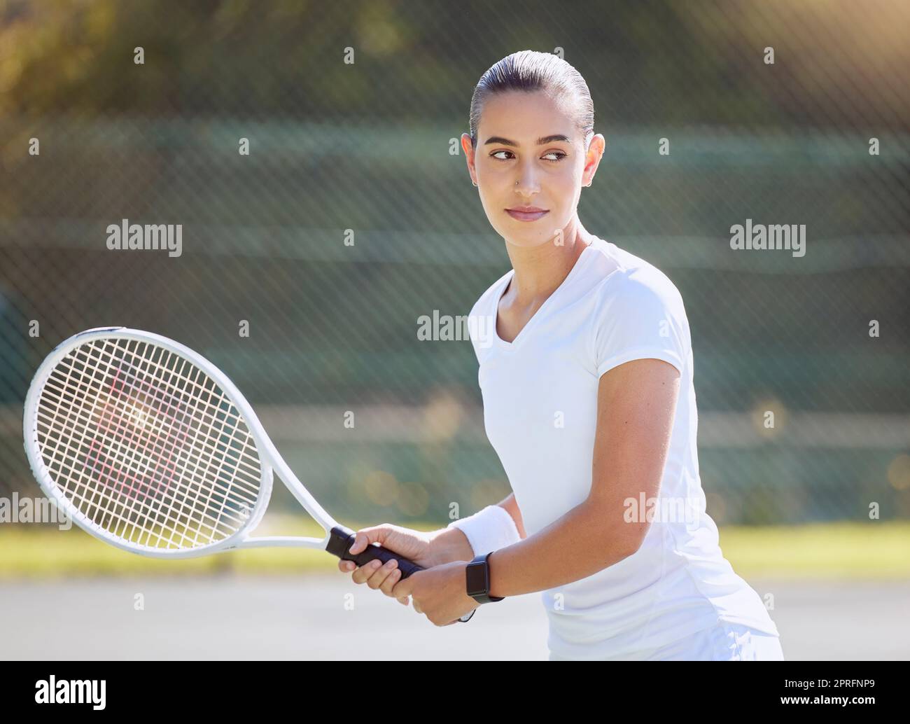 Tennis, sport and woman holding her racket and ready to play on court ...