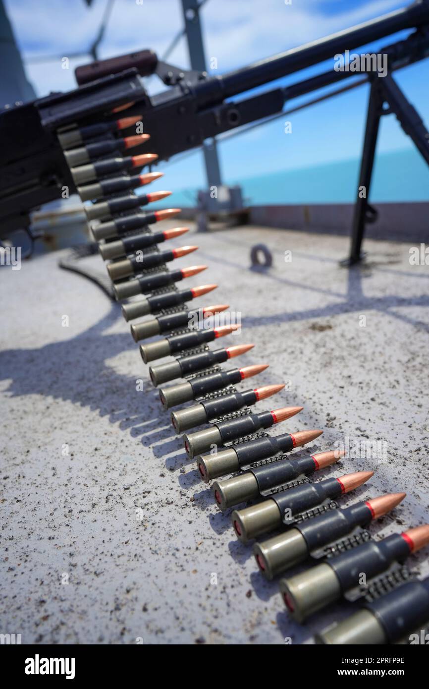 Close up shot of a machine gun belt loaded with cartridges Stock Photo ...