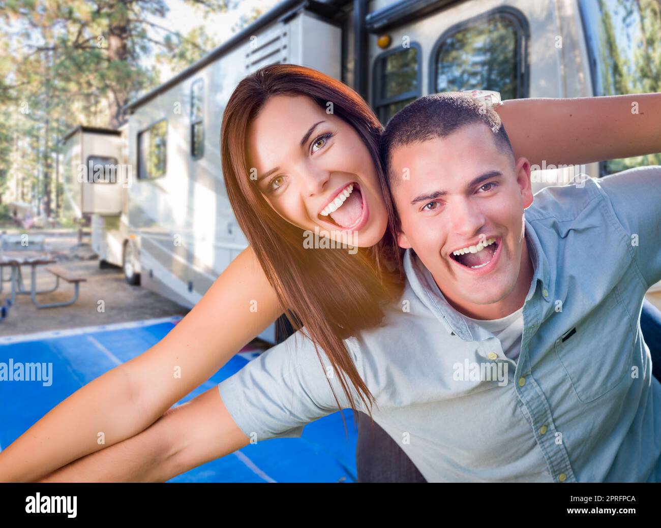 Young Adult Military Couple In Front of Their Beautiful RV At The ...