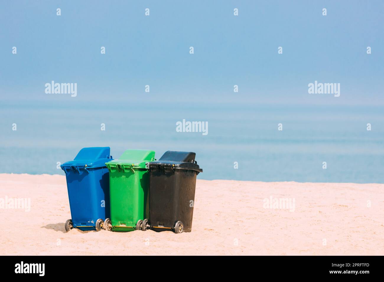 Three Plastic Waste Containers On Wheels For Separate Collection Of ...