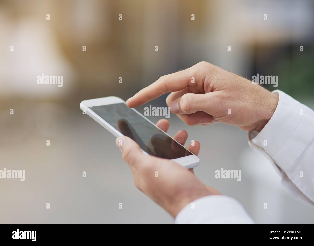 Scrolling through his appointments. an unrecognizable businessman using his cellphone Stock ...