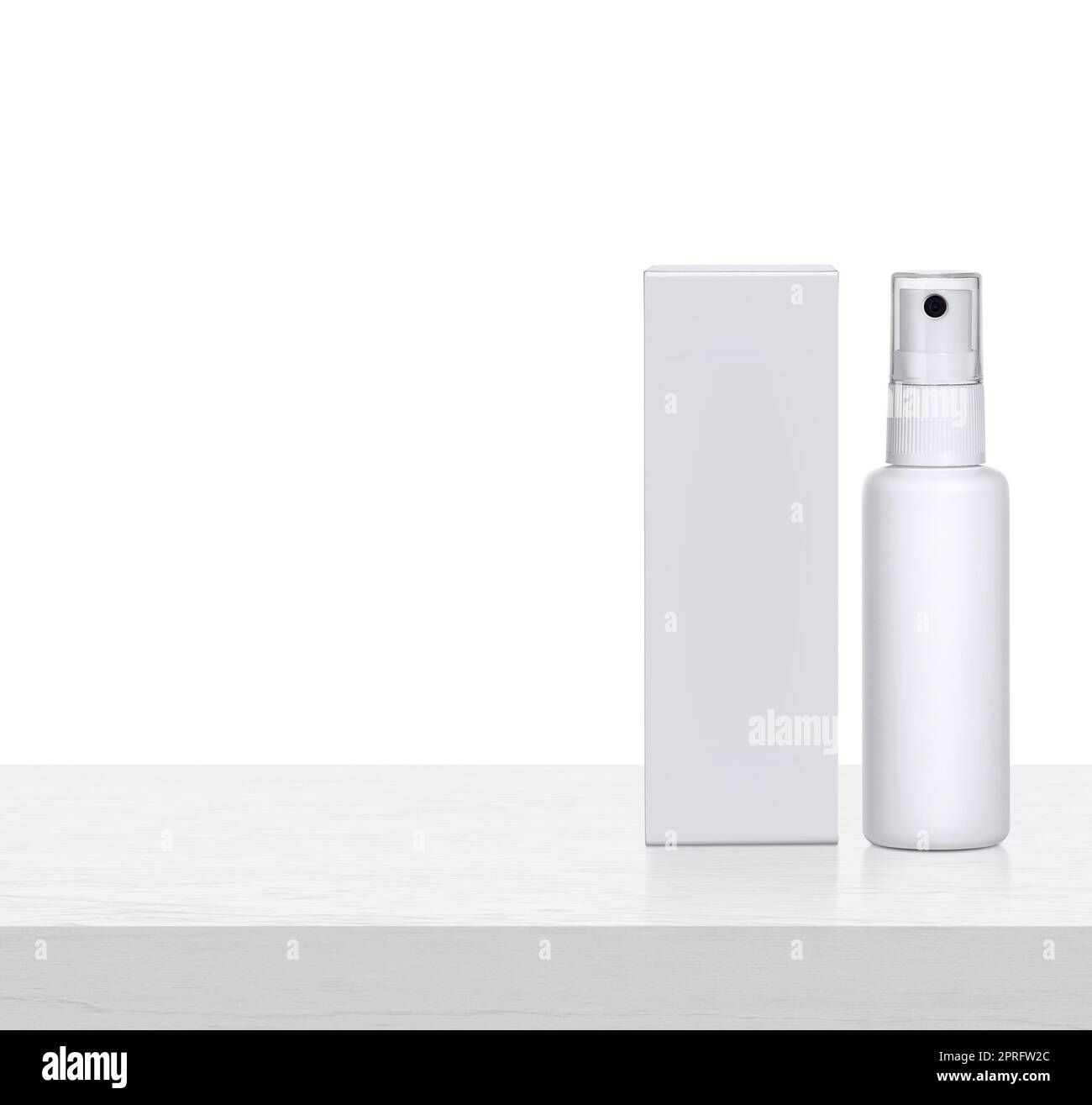 Plastic spray bottles blank and packaging on white wooden table. for ...