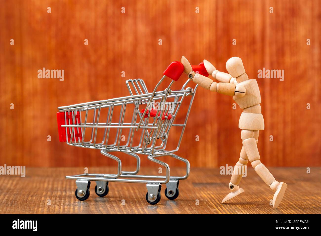 Customer with shopping cart Stock Photo - Alamy