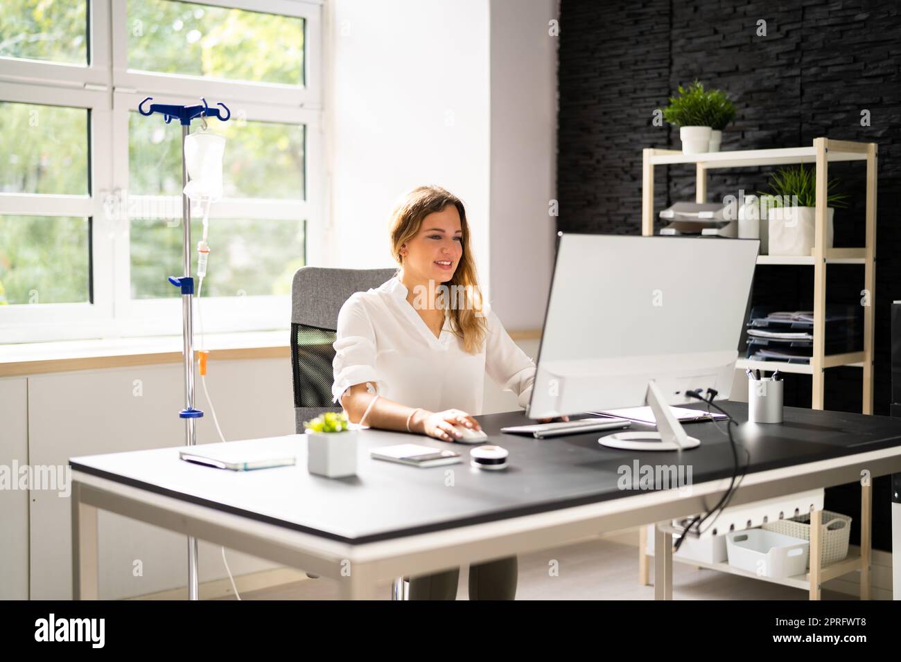 IV Drip Therapy In Office Stock Photo - Alamy