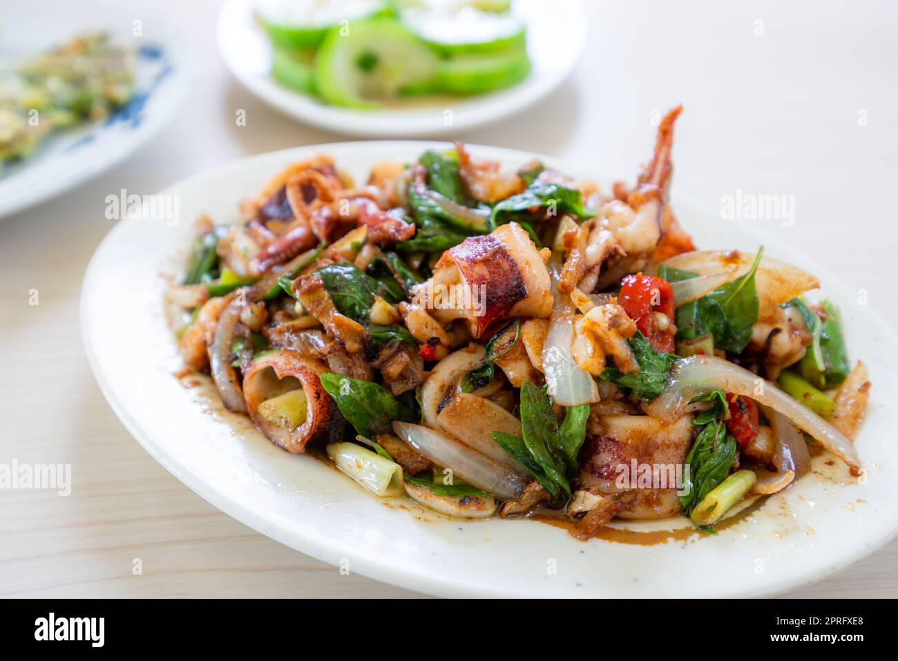 Penghu seafood fried squid with basil Stock Photo - Alamy