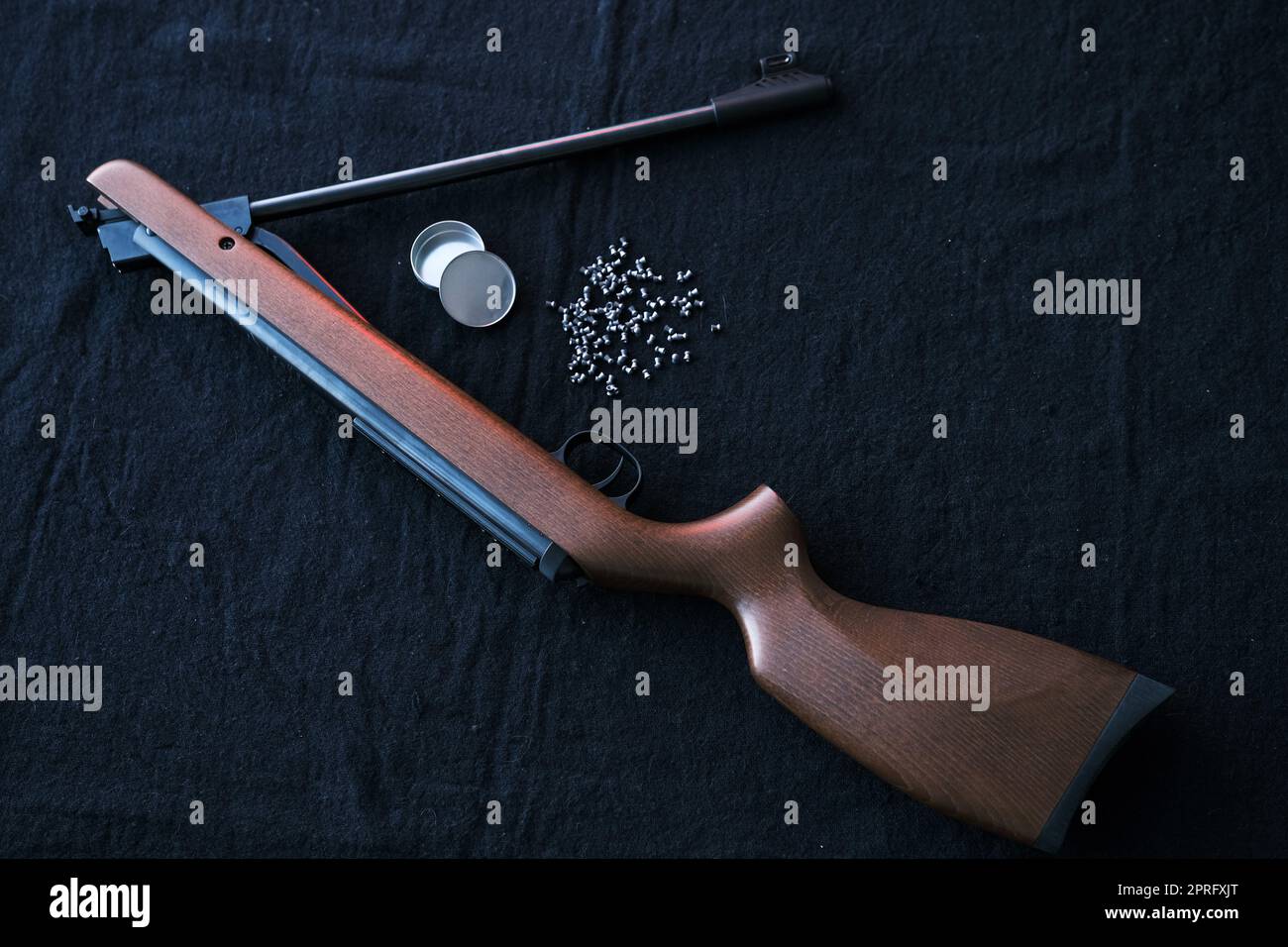 Rifle gun break in two with air pellets for hunting on cloth dark ...