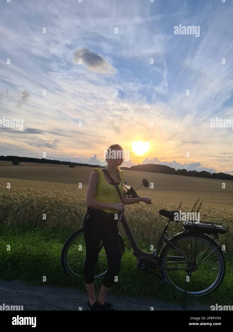 Girl on bicycle in green hi-res stock photography and images - Alamy