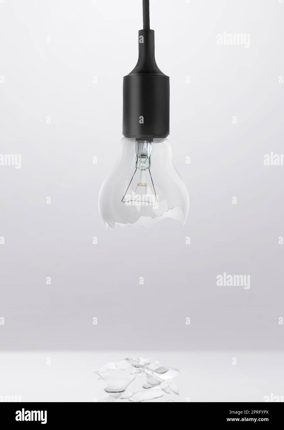 Concept idea broken glowing bulb hi-res stock photography and images ...