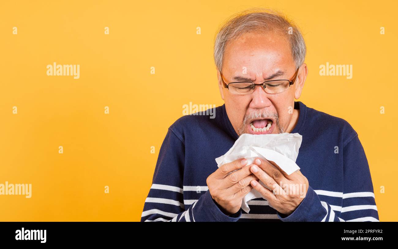 Asian elder man cold having flu and sneezing from sickness virus ...