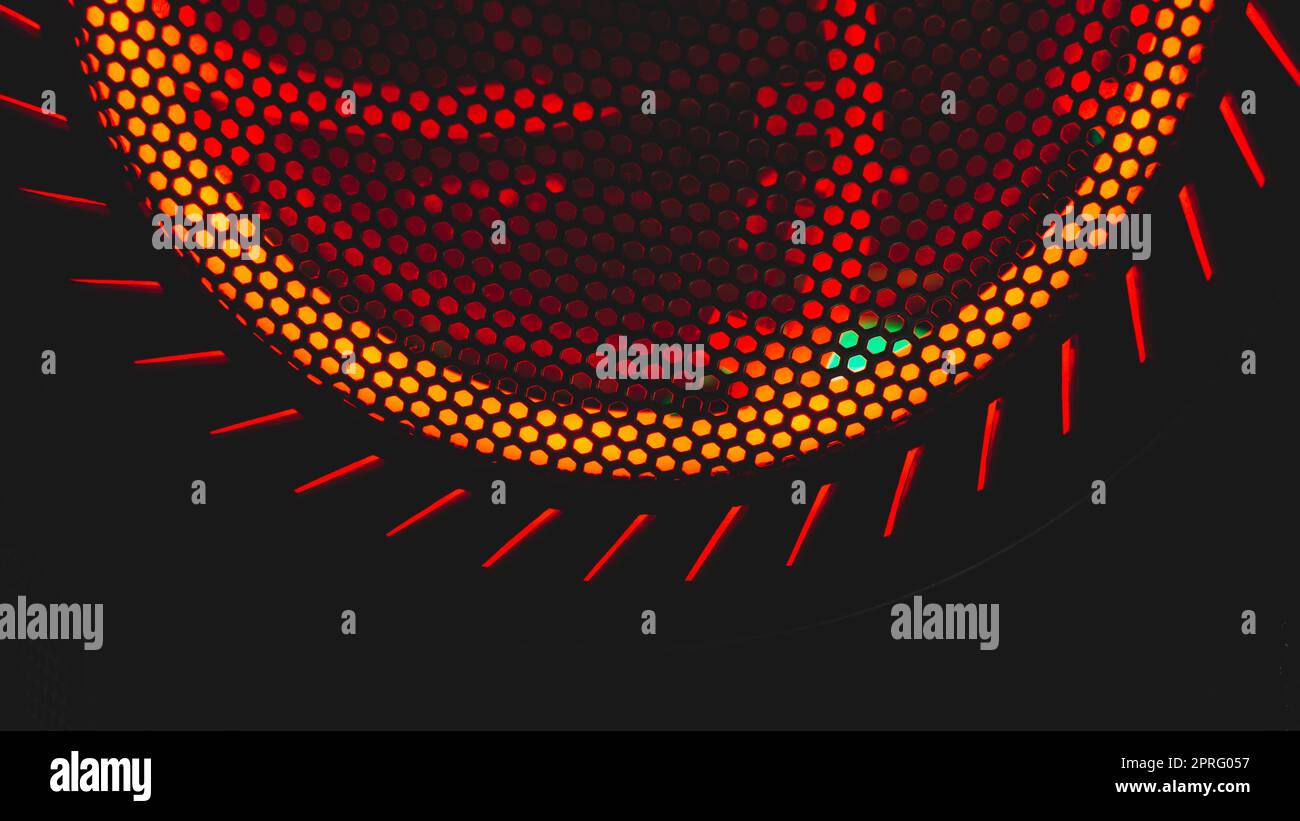 Detail of computer fan with red light abstract background. cooler grid ...