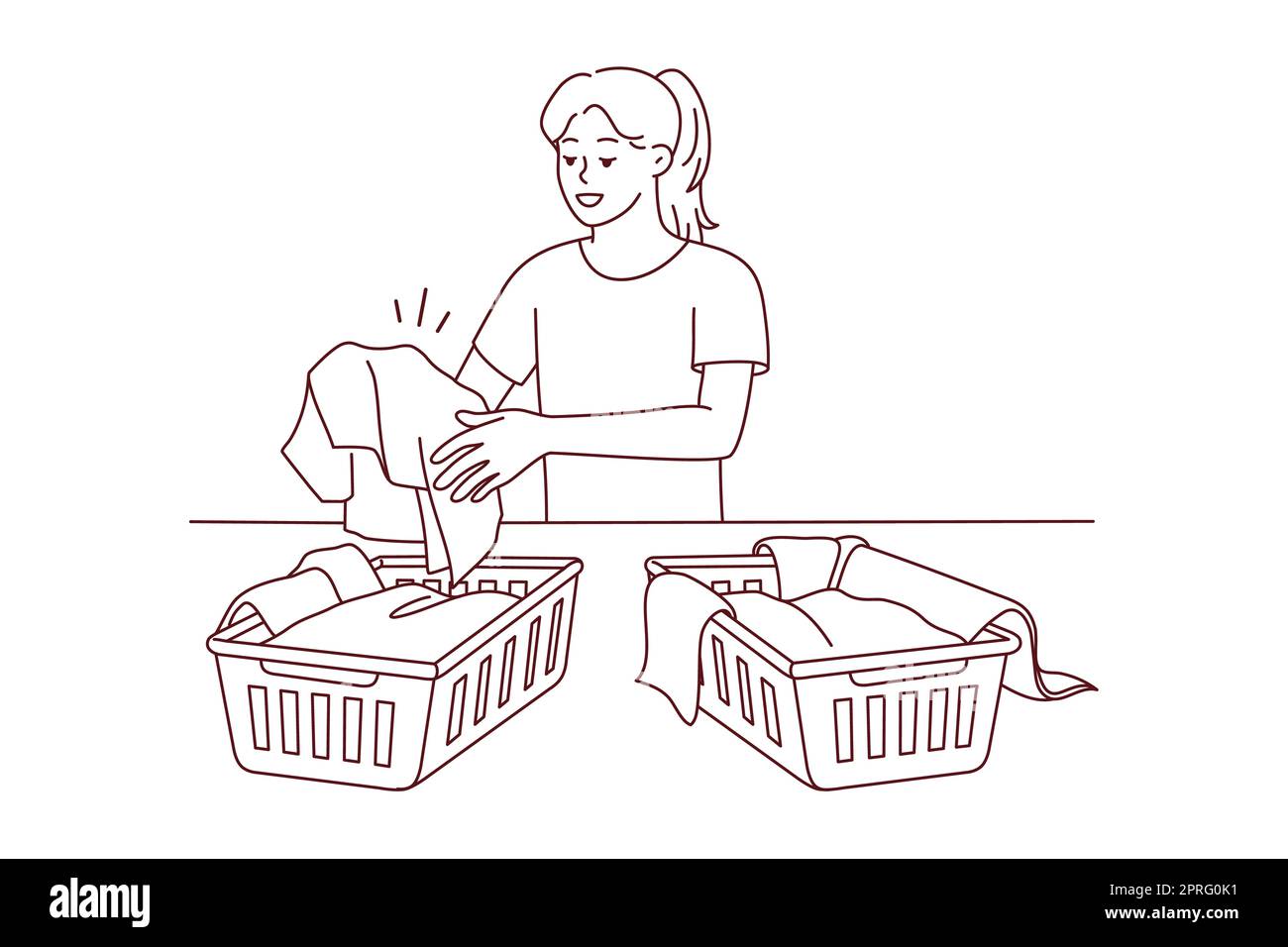 Woman sorting dirty clothes for washing. Girl gathering laundry in ...