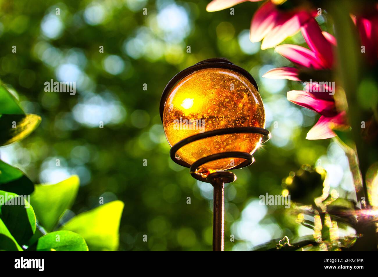 yellow glass ball in the sunlight on the balcony. sometimes the ...
