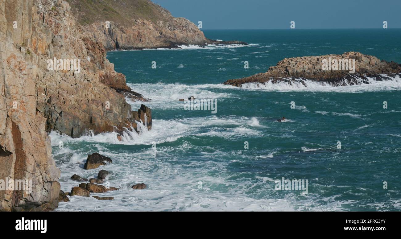 Sea waves splash on the rock Stock Photo - Alamy