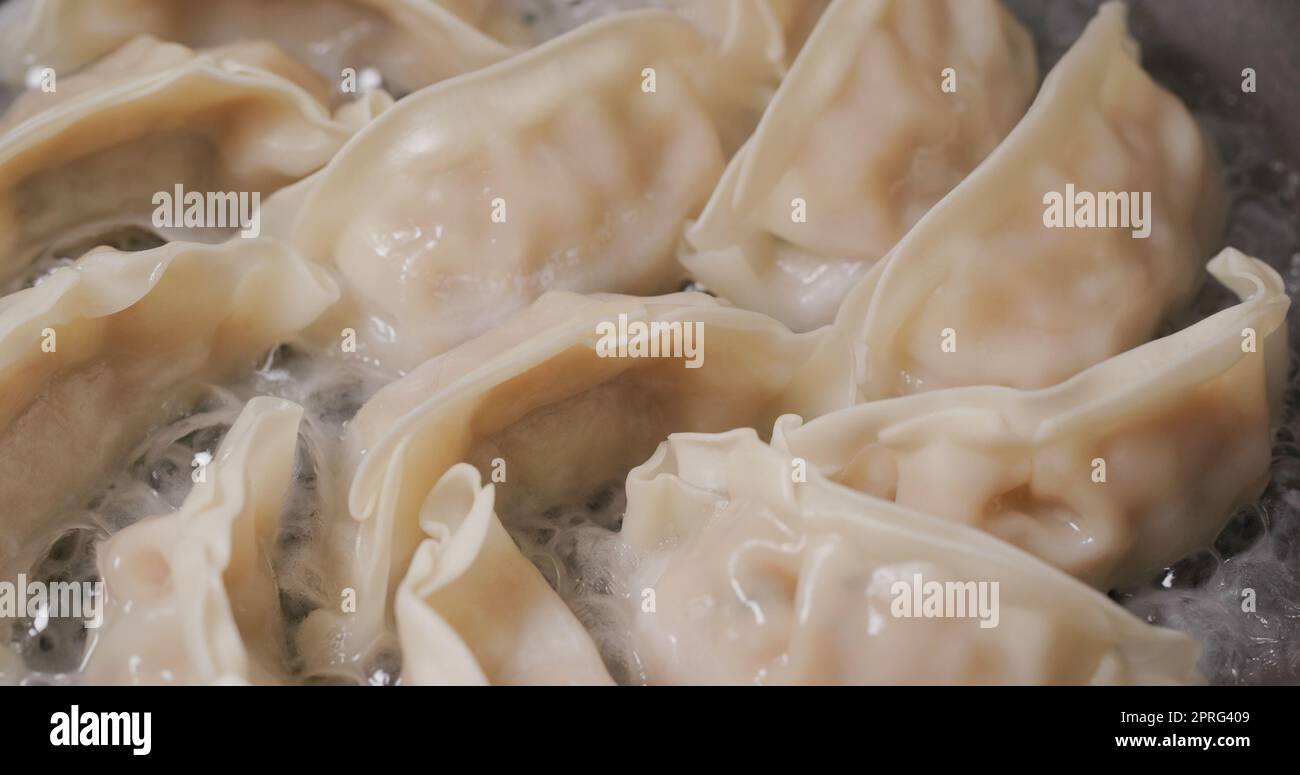 Grilling japanese dumpling on fry pan Stock Photo - Alamy