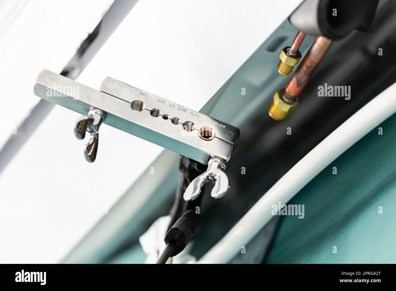 Close up of specialized tool for connecting copper pipes when ...