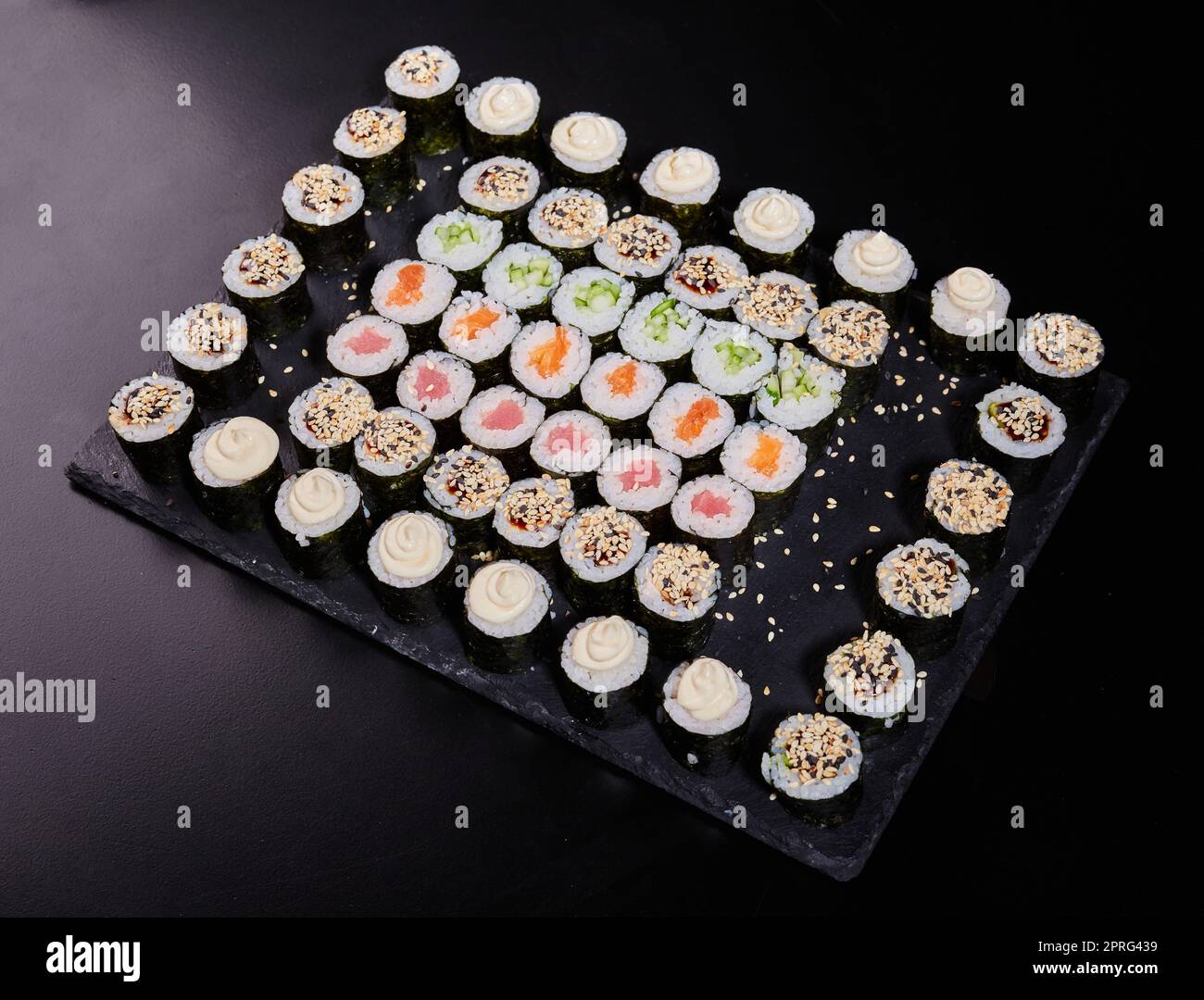 Different types of maki rolls on a plate on a stone background Stock ...