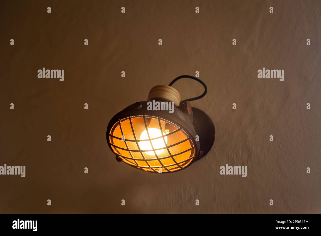 A spotlight-like lamp attached to a house wall Stock Photo - Alamy