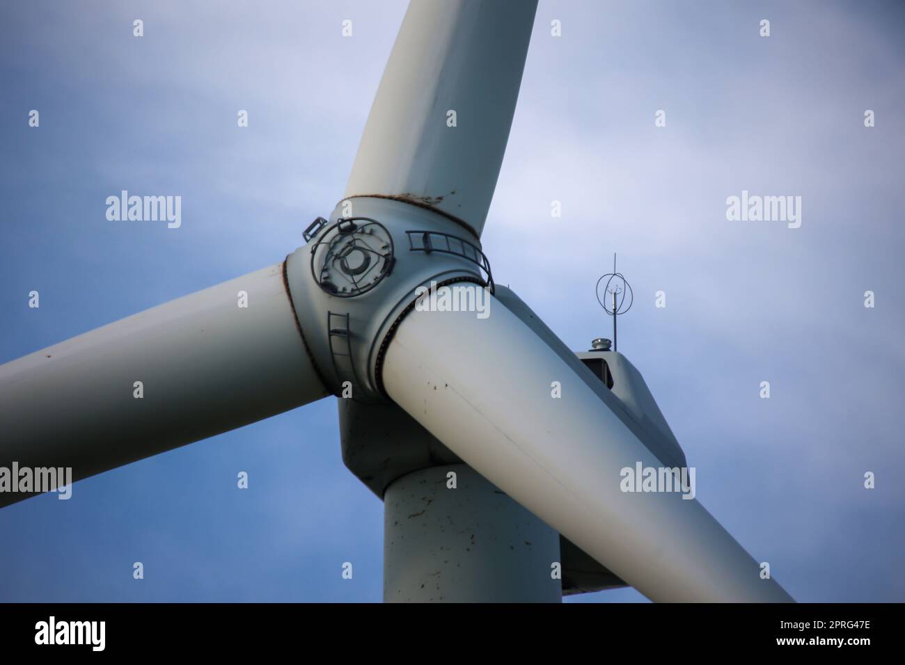 Close-up of the hub of a wind turbine. Blade and hub of a wind turbine ...