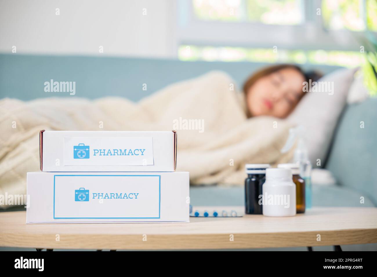 Asian young woman tired sick she sleep and resting on sofa after take ...