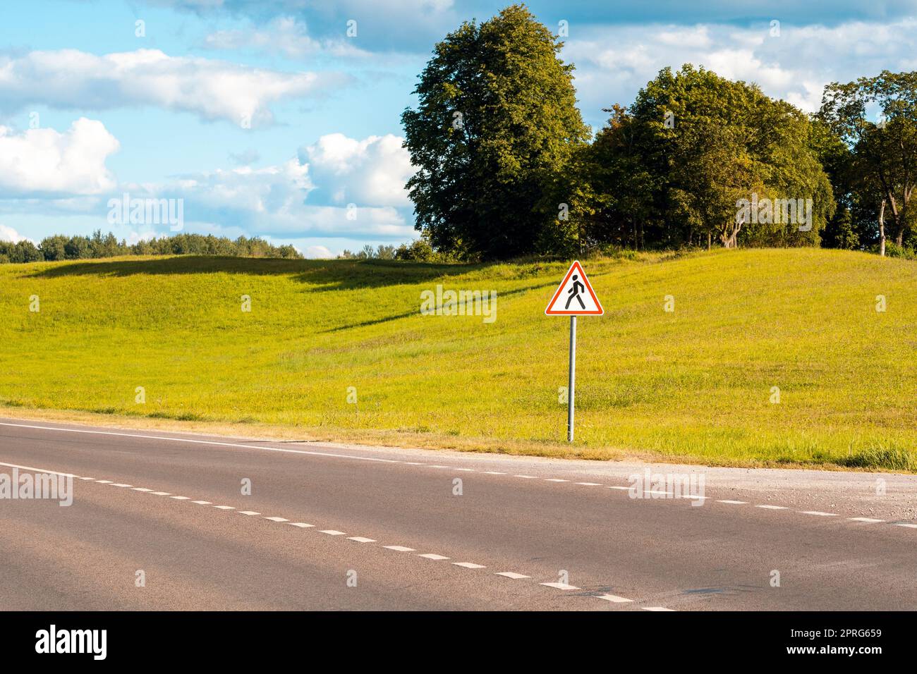 Country road and pedestrians in road sign Stock Photo - Alamy