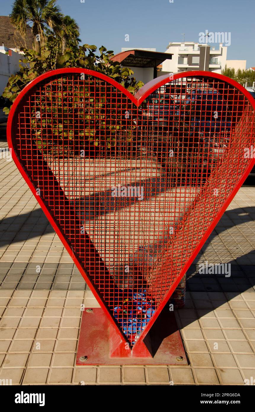 Heart-shaped structure to deposit plastic caps Stock Photo - Alamy