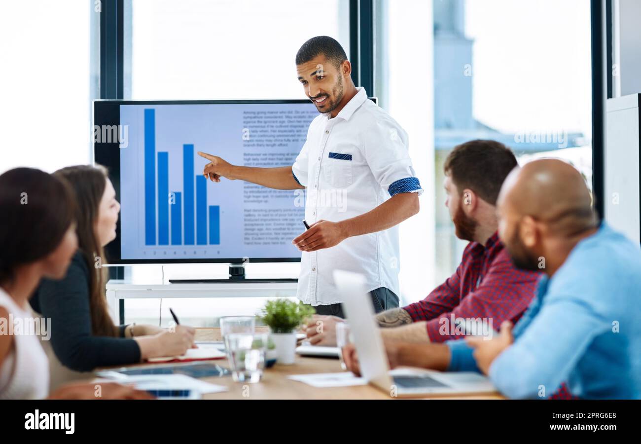 These numbers tell the story. a young male designer giving a ...